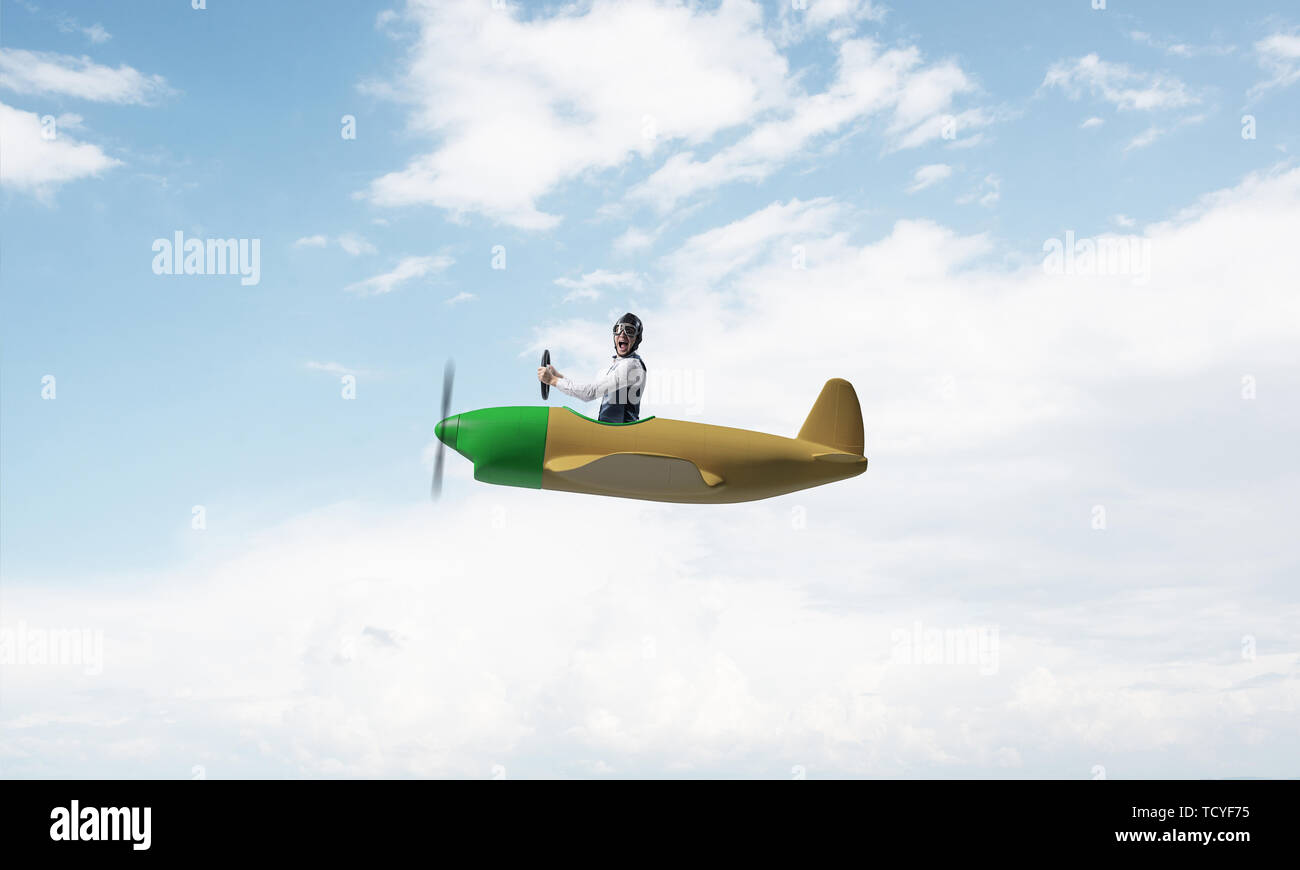 Happy pilot driving small propeller plane Stock Photo - Alamy