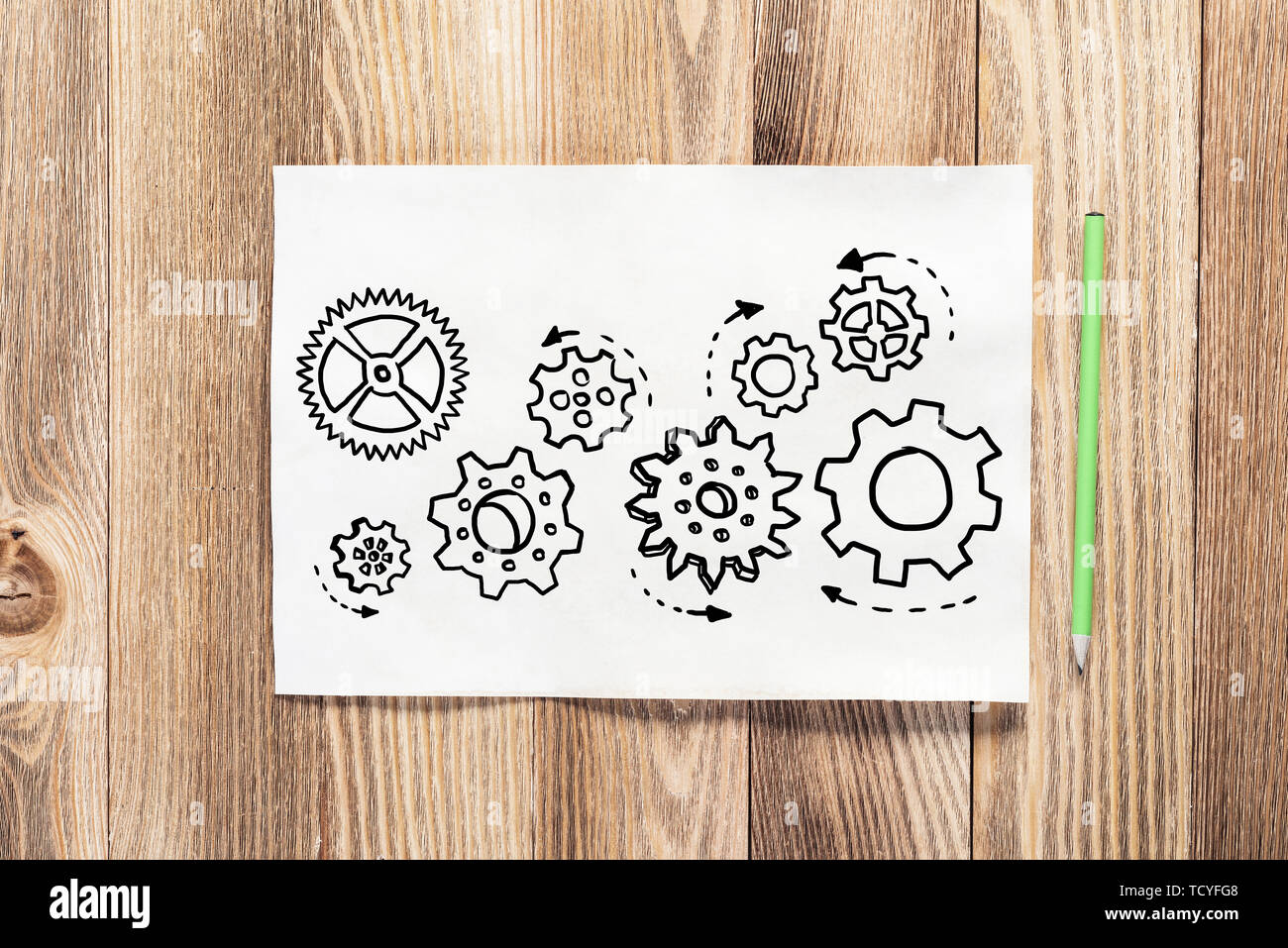 Rotating gears pencil hand drawn Stock Photo - Alamy