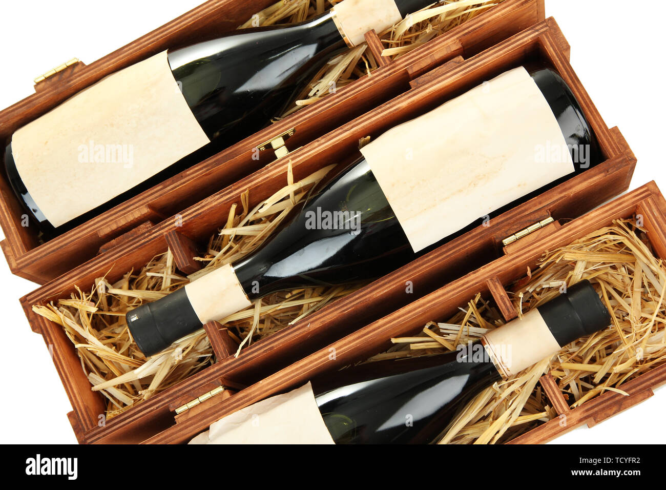 Bottles of old red wine in gift wooden box, isolated on white Stock ...