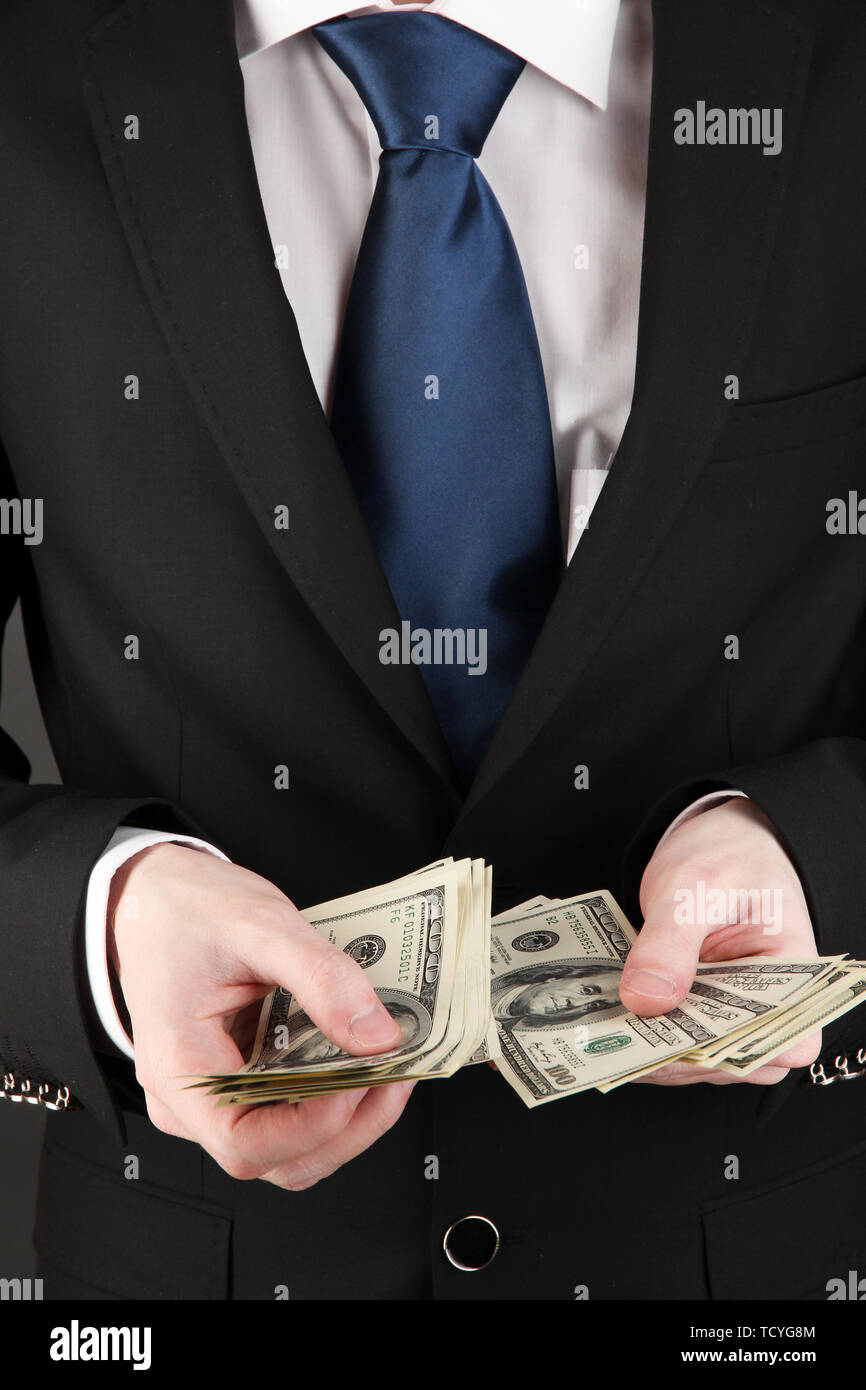 Business man counts money close-up Stock Photo - Alamy