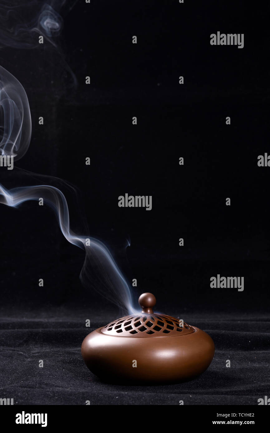 Copper incense stove Stock Photo - Alamy