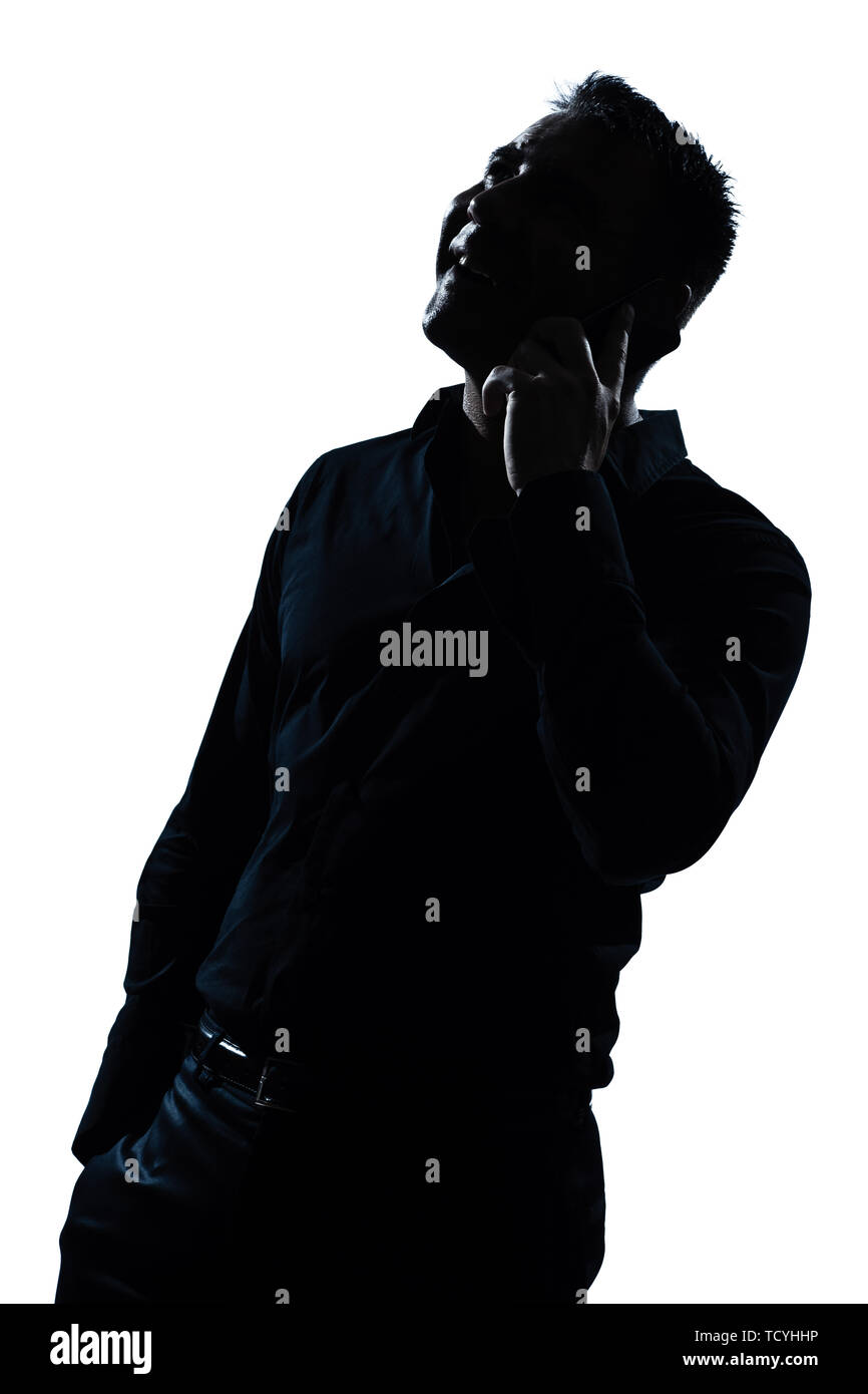 one caucasian man happy telephone portrait silhouette in studio ...