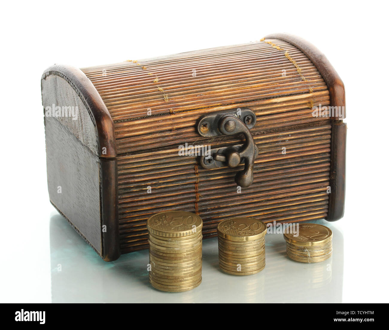 Coins in chest isolated on white Stock Photo - Alamy