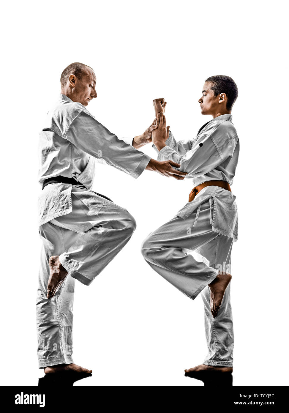 two karate men sensei and teenager student teacher teaching isolated on ...