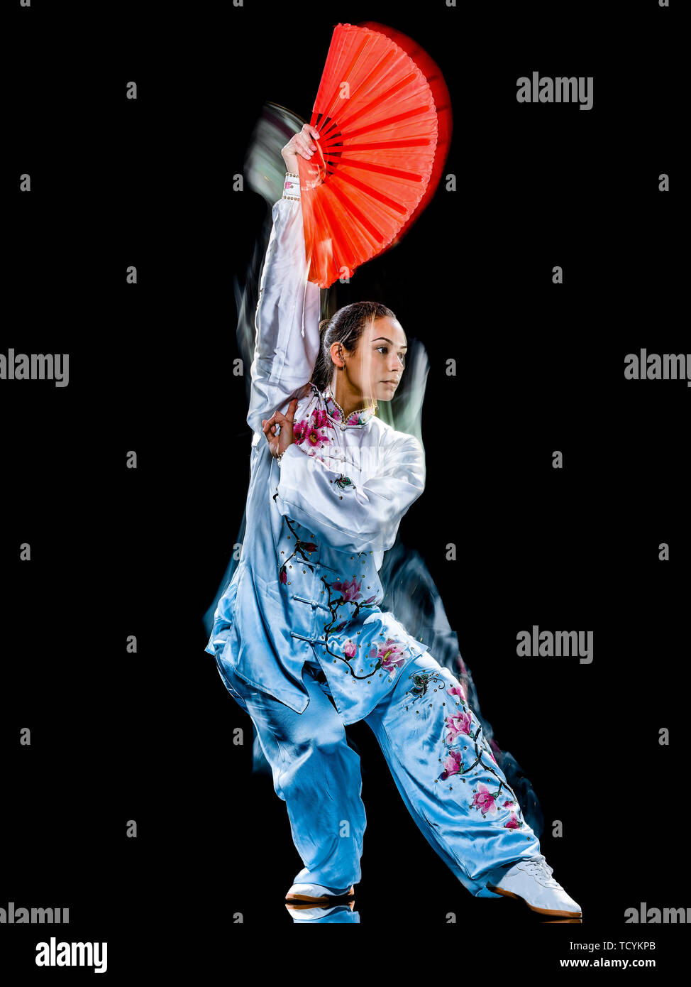 one chinese woman partacticing Tai Chi Chuan Tadjiquan posture studio ...