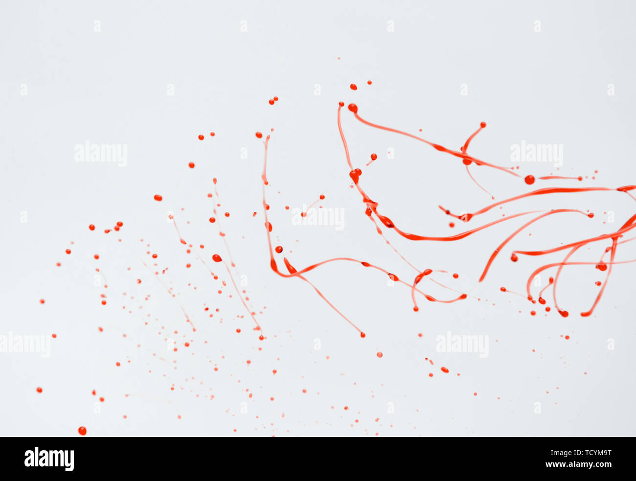 Red droplets splashed under high-speed photography Stock Photo - Alamy