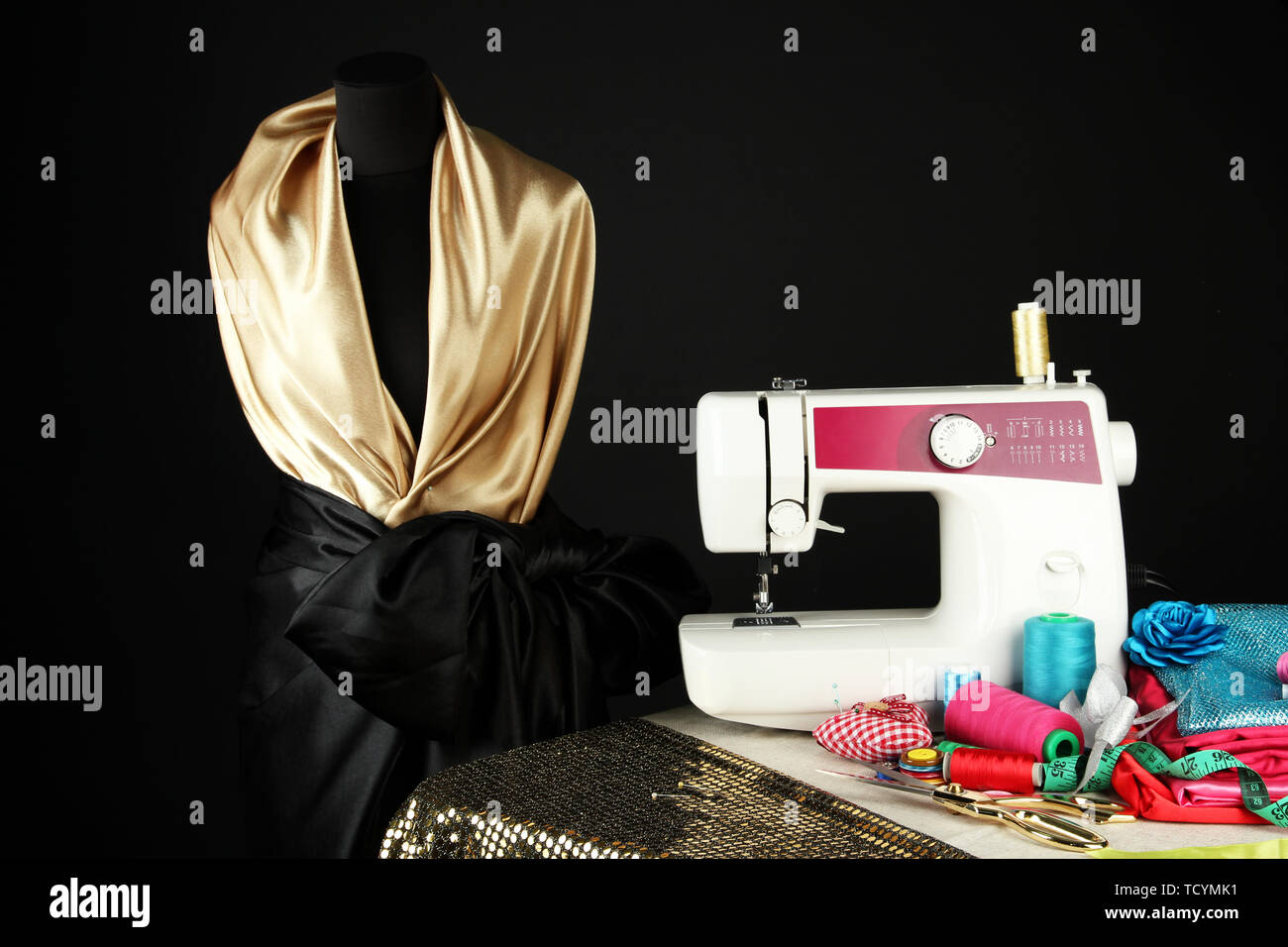 Sewing machine, dummy and other sewing equipment isolated on black ...