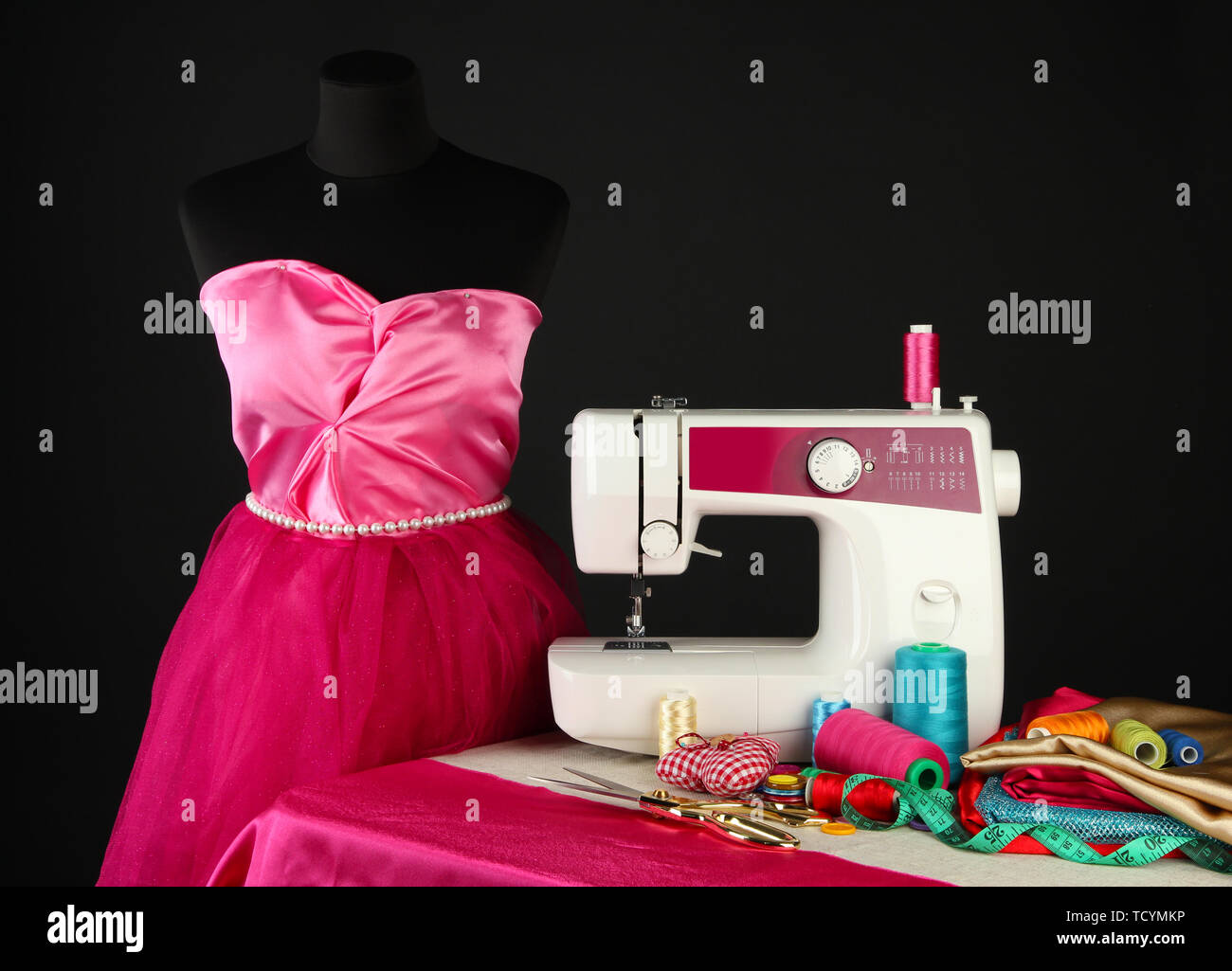 Sewing machine, dummy and other sewing equipment isolated on black ...