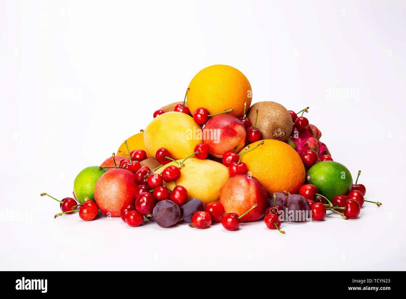 Colorful delicious fresh fruit on white background Stock Photo - Alamy