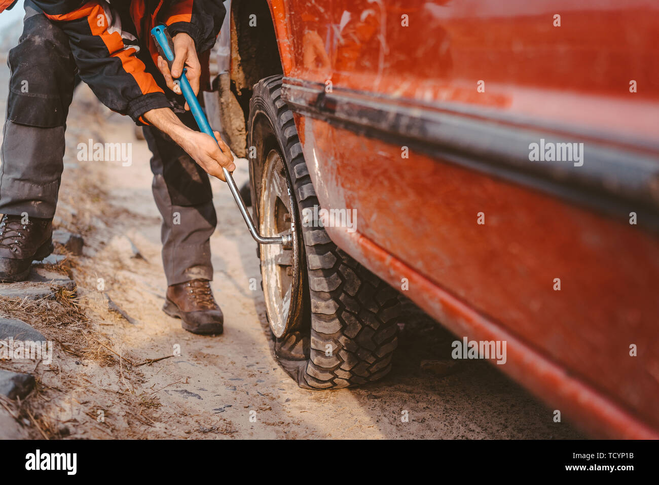 Car service worker unscrews bolts hi-res stock photography and images ...