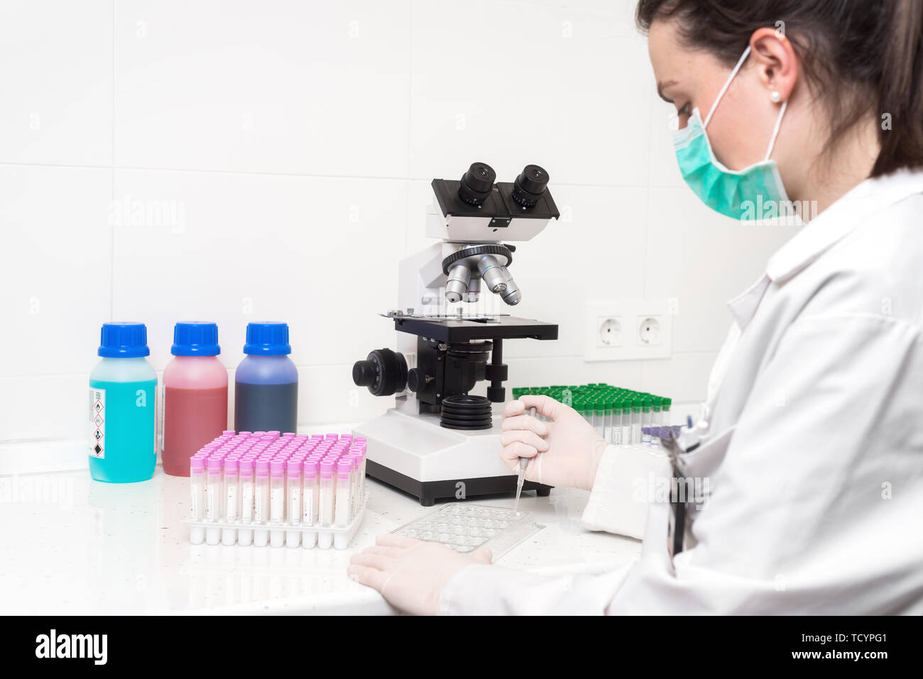 Scientist researcher using microscope in laboratory. Medical healthcare ...