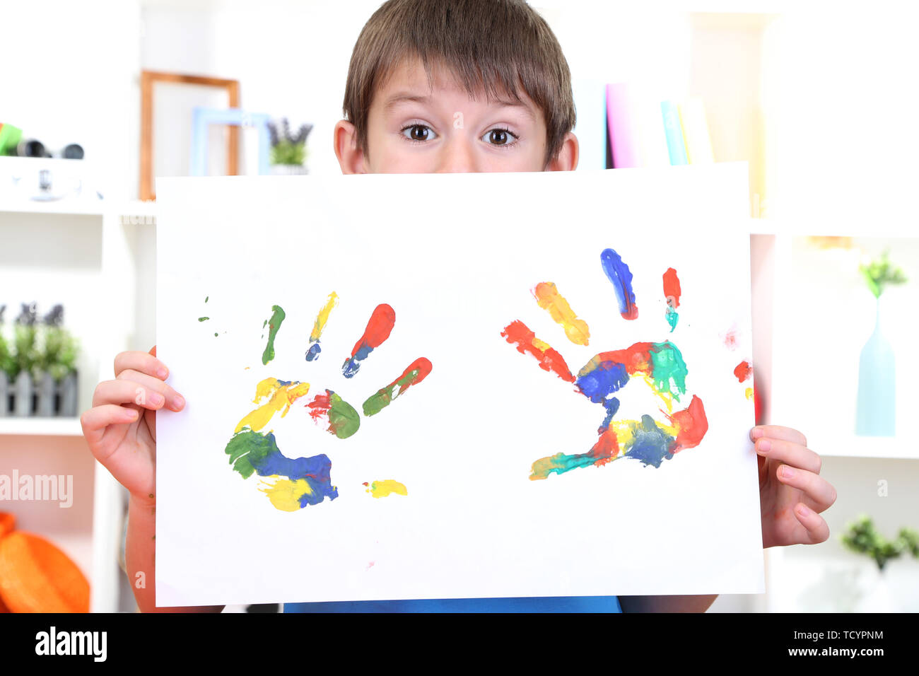 Cute little boy with his colorful handprint Stock Photo - Alamy