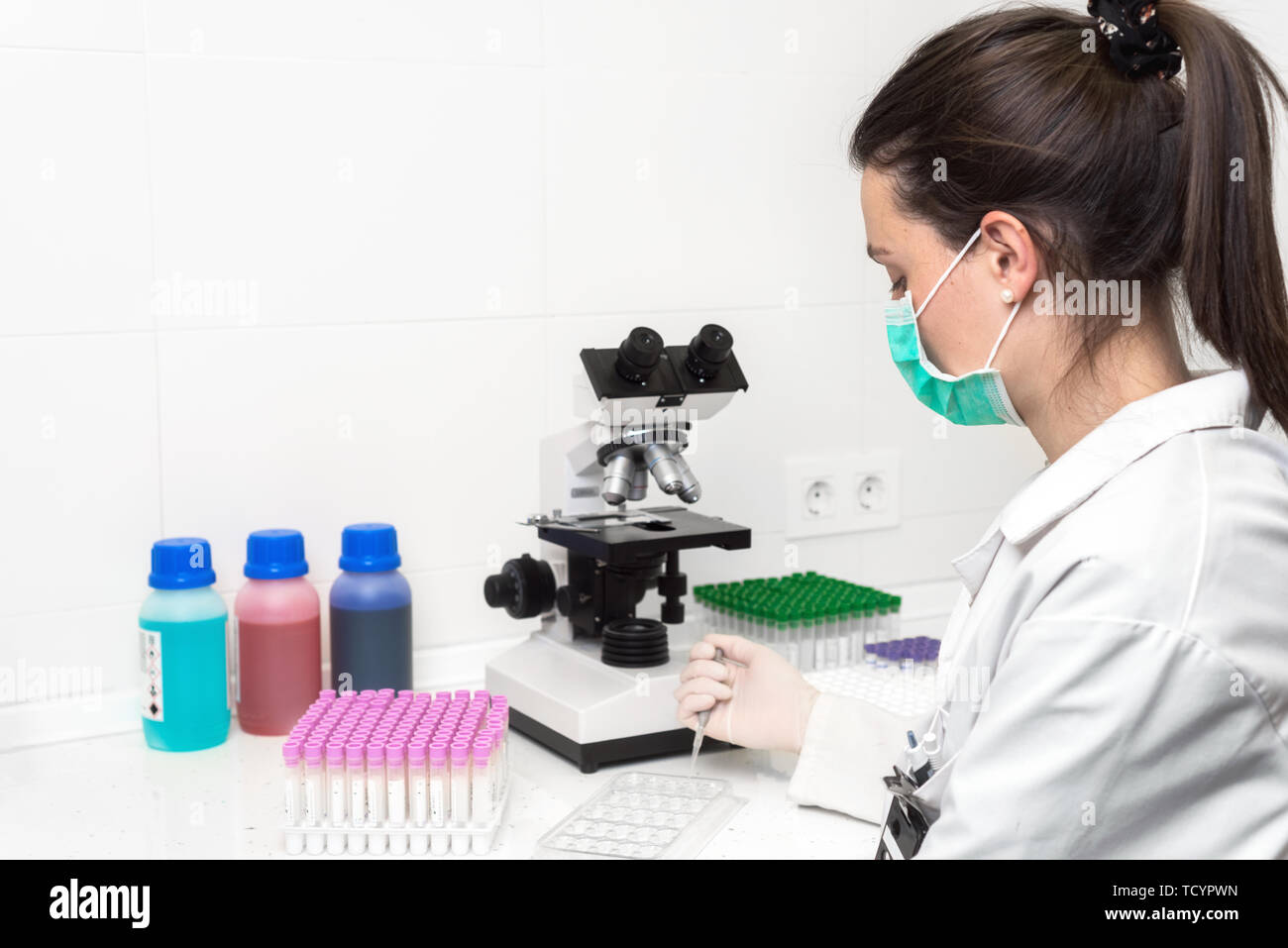 Scientist researcher using microscope in laboratory. Medical healthcare ...