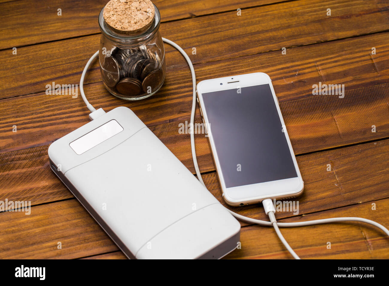 Charging treasure phone Stock Photo - Alamy