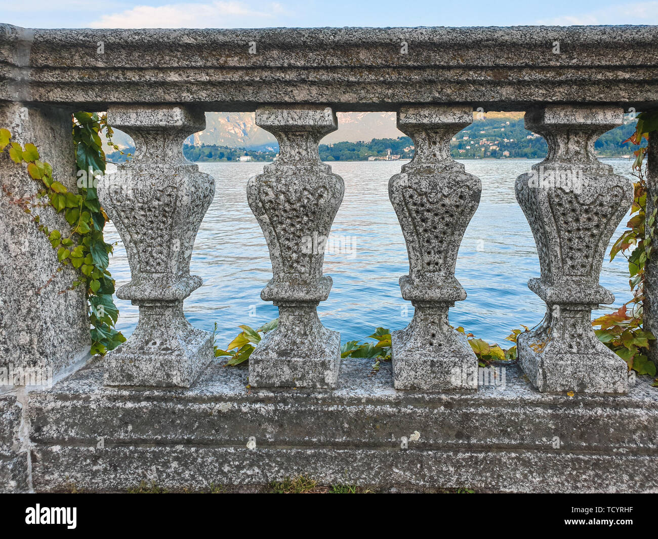 Image of Italian stone balustrade illuminated by sun rays and water in ...