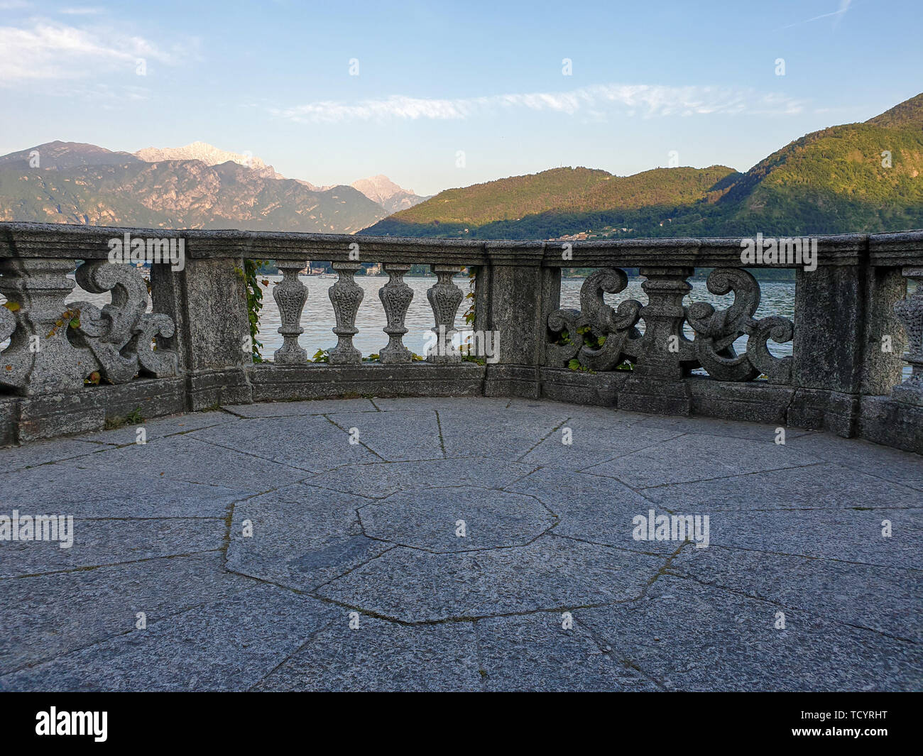 Image of Italian stone balustrade illuminated by sun rays and water in ...
