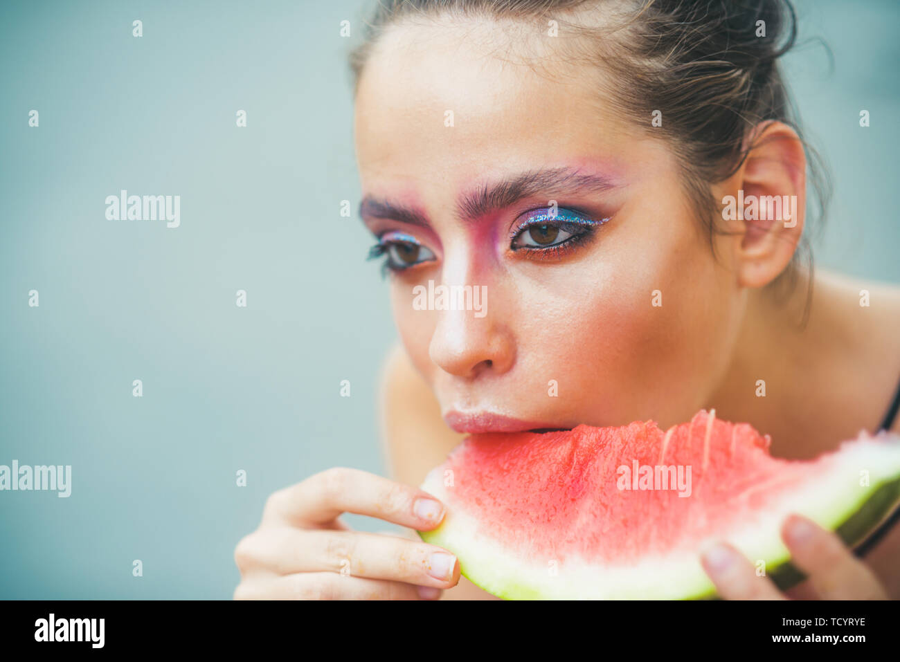 Summer, fruit, harvest season. Young woman eat juicy watermelon. Girl ...