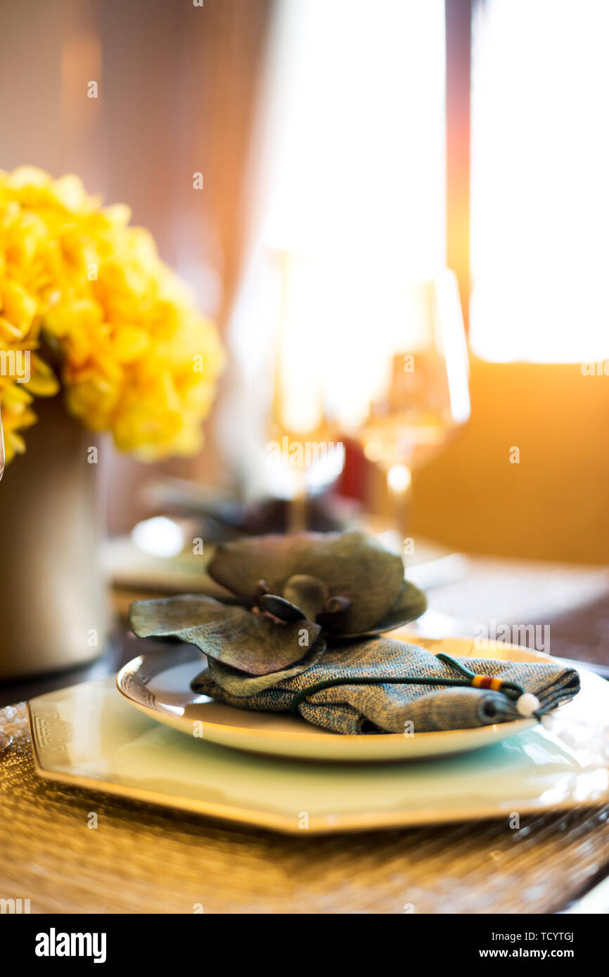 elegant crockery on dining table in modern dining room Stock Photo - Alamy