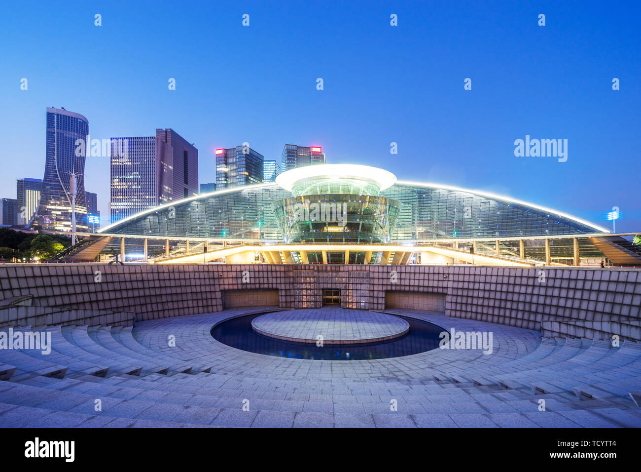 modern buildings in midtown of modern city at night Stock Photo - Alamy