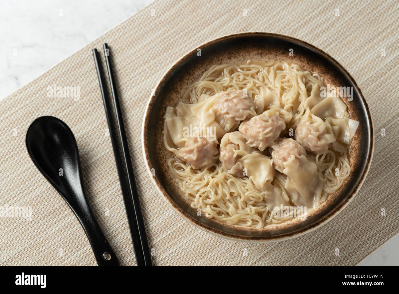 Cloud noodles and utensils on the mat Stock Photo - Alamy