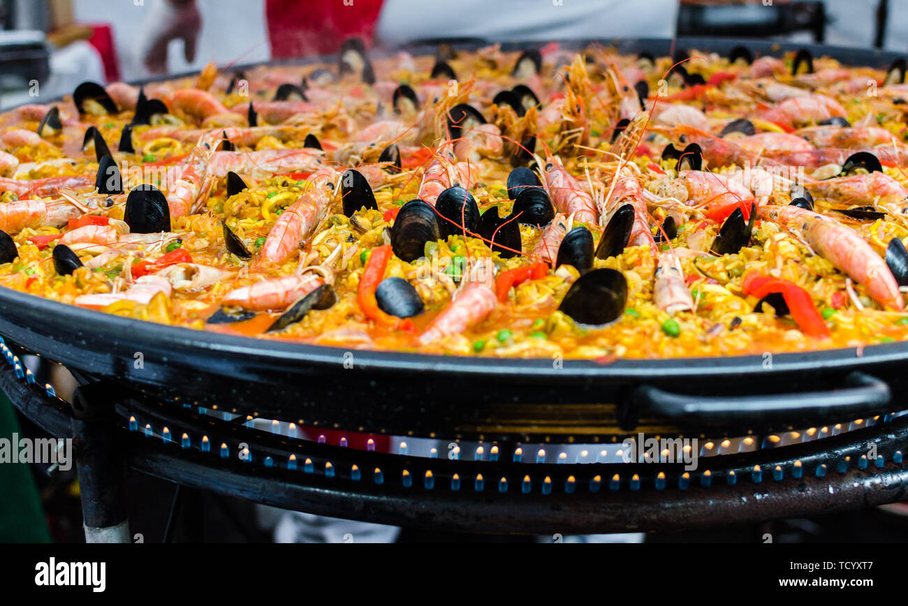 Seafood paella in a paella pan at a street food market Stock Photo - Alamy