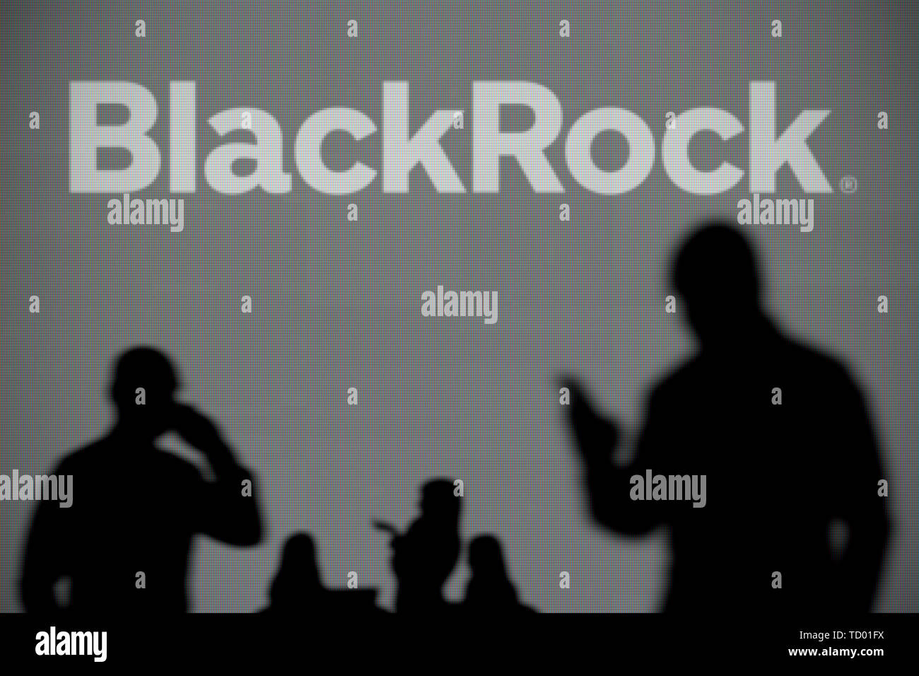 The Blackrock logo is seen on an LED screen in the background while a ...