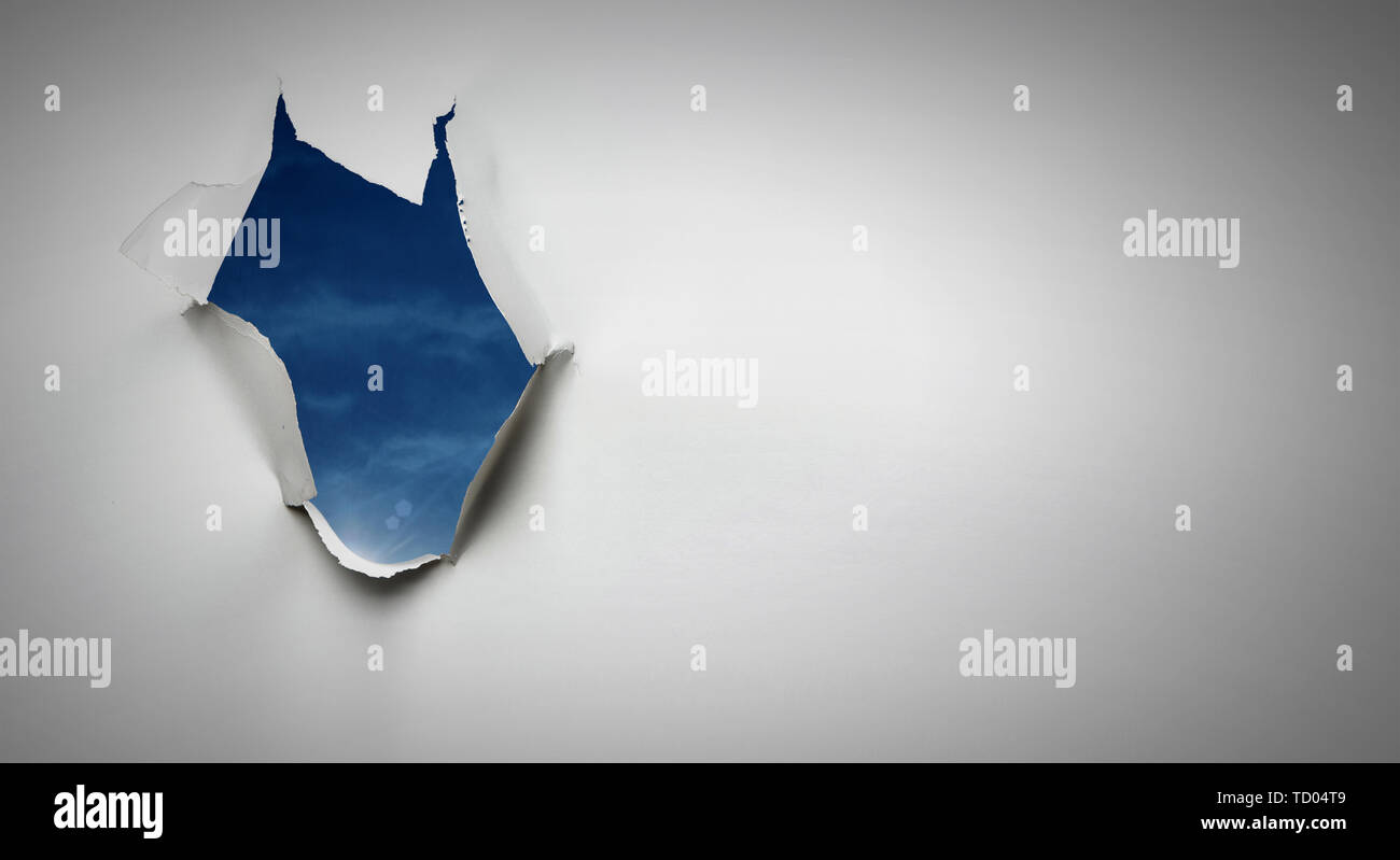 Paper torn hole effect with night sky view Stock Photo - Alamy