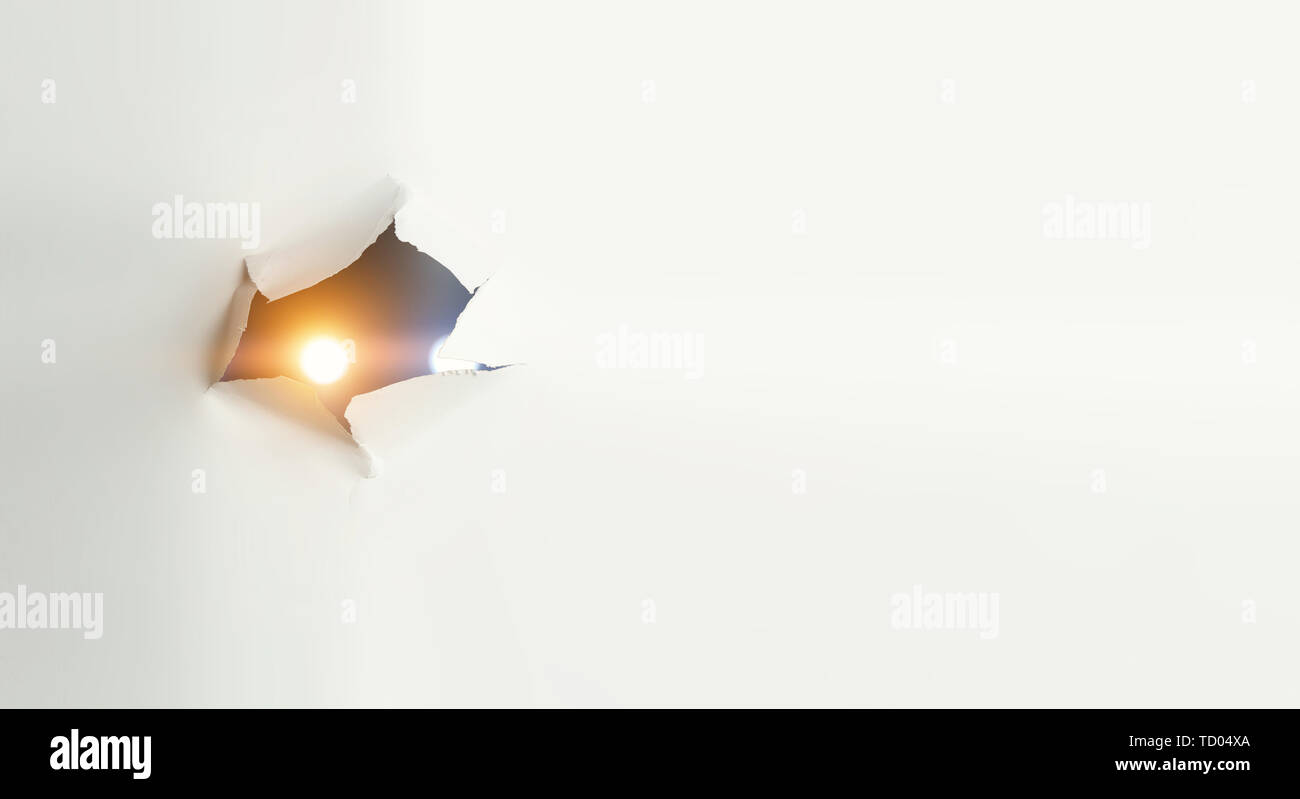 Paper torn hole effect with stadium view Stock Photo - Alamy