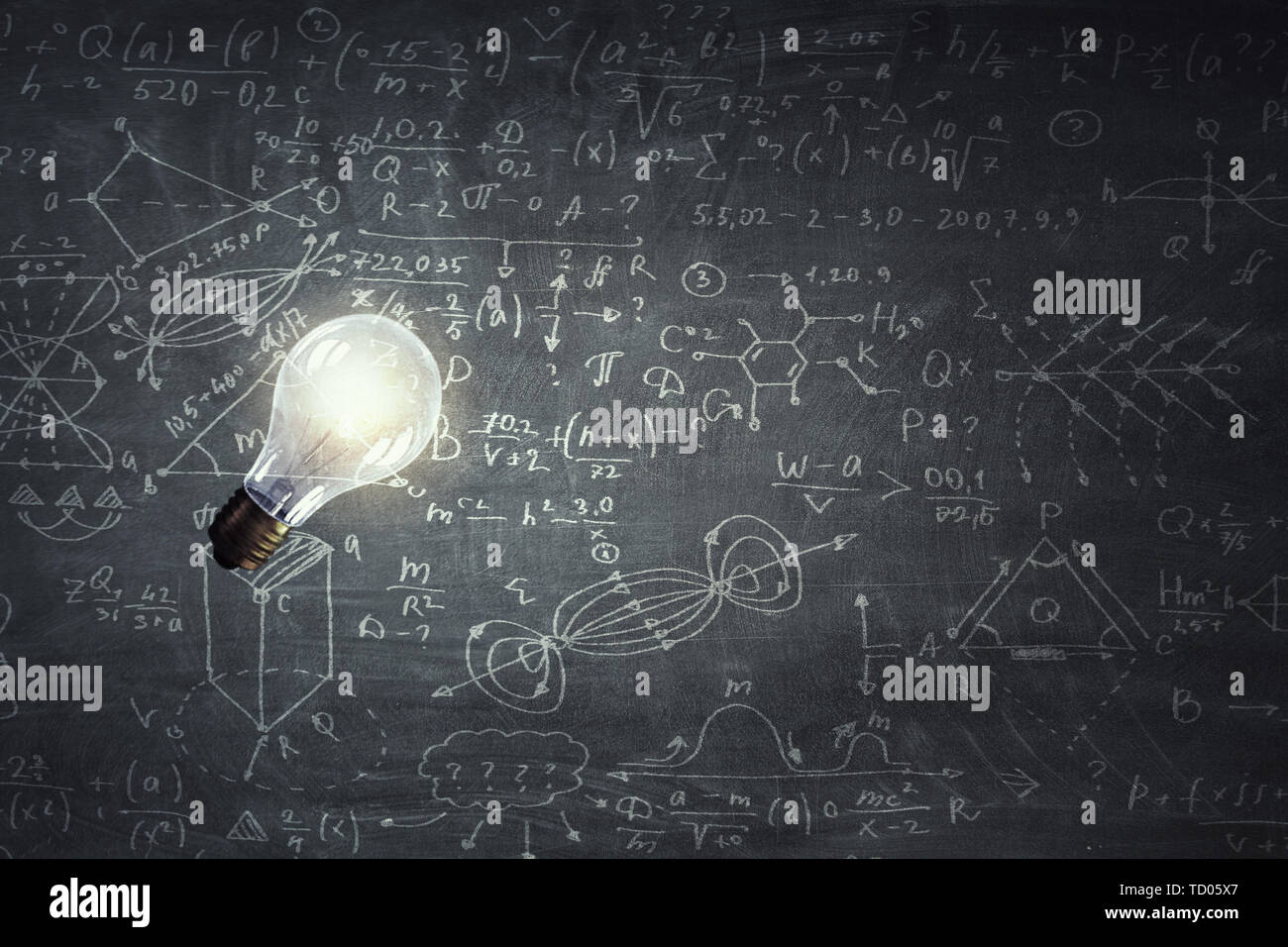 Light bulb on chalk board background Stock Photo - Alamy