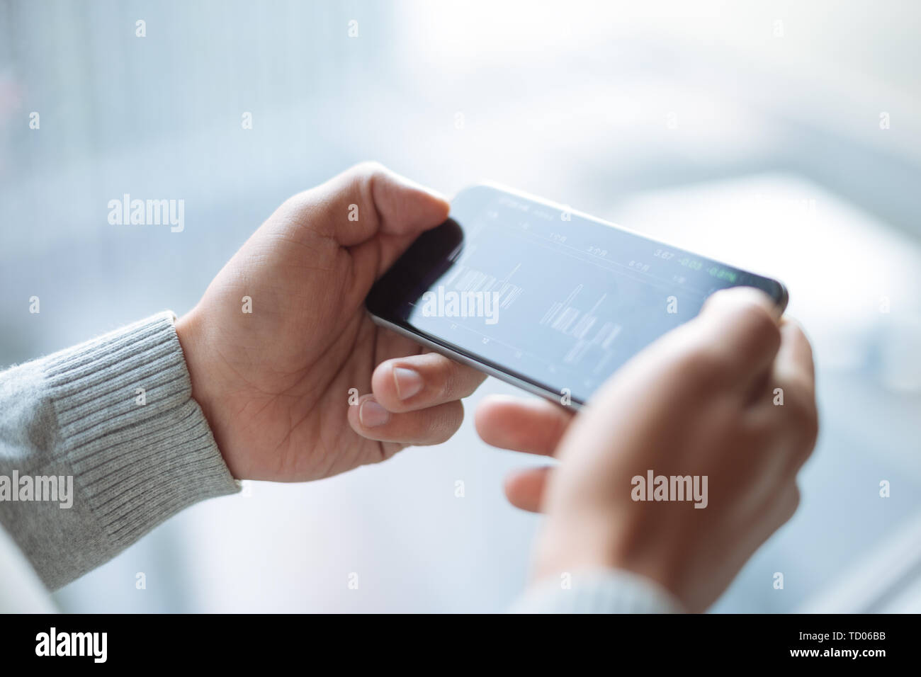 Mobile phone in man's hand Stock Photo - Alamy