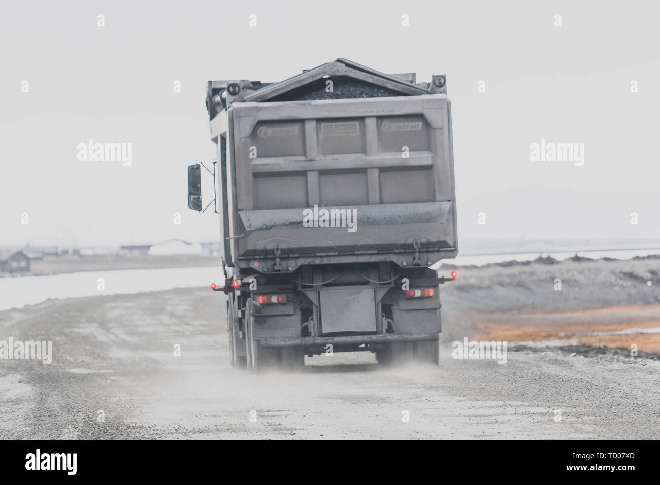 Inside adventdalen fjord - Truck carry coal from mine Number 7 - clouds ...