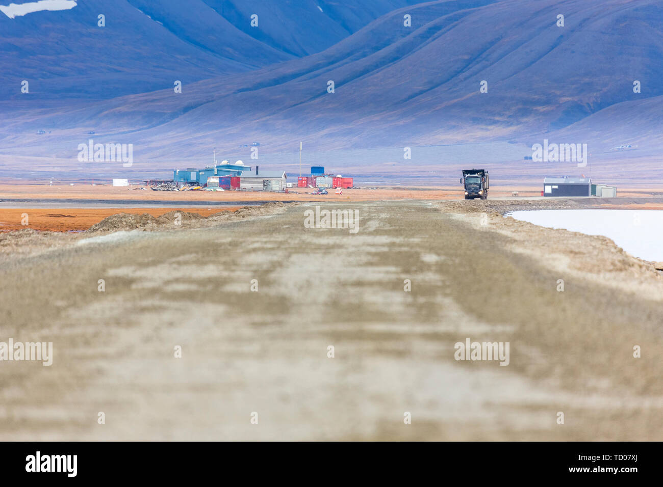 Inside adventdalen fjord - Truck carry coal from mine Number 7 - clouds ...