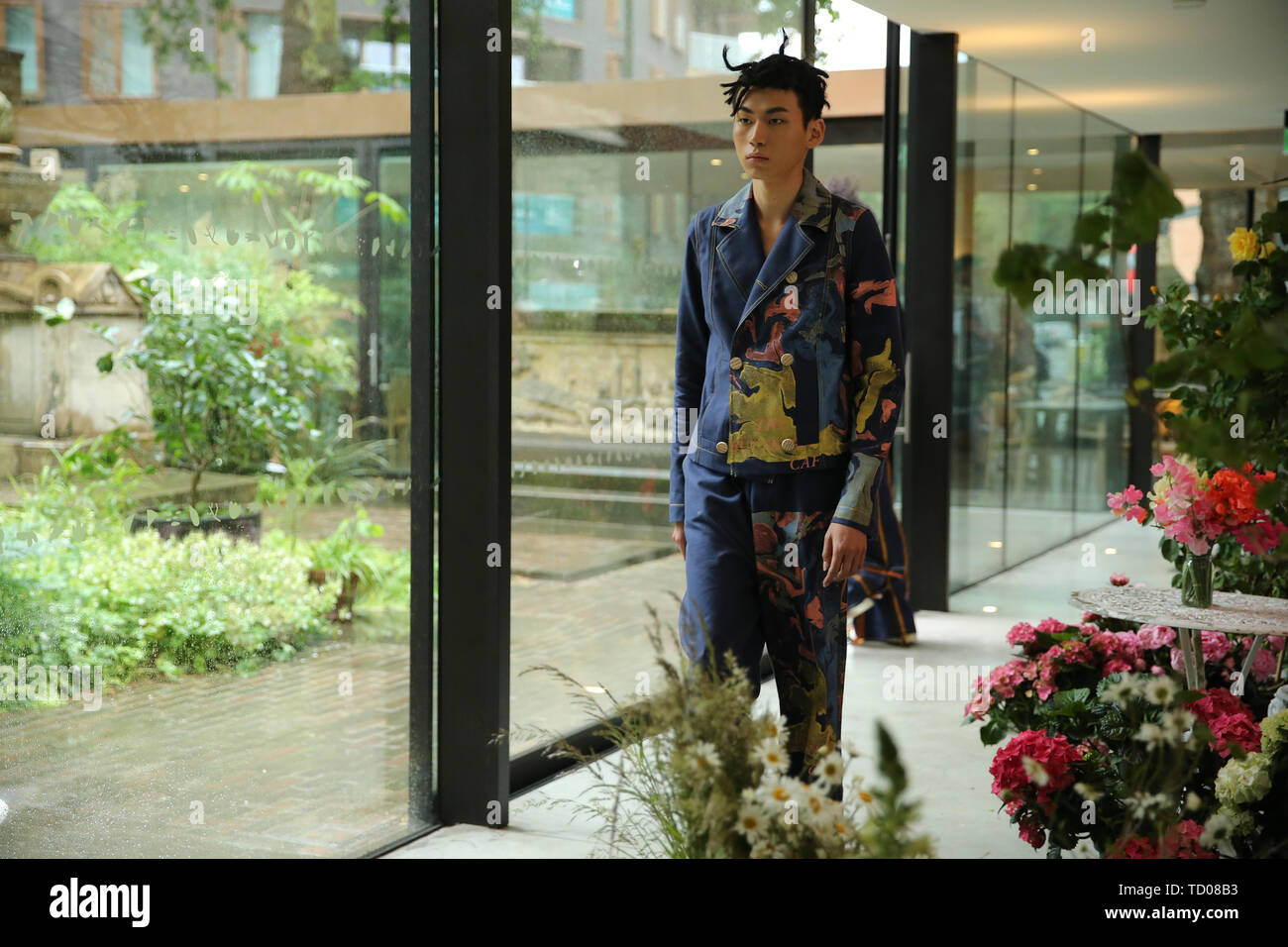 Models on the catwalk during the Bethany Williams London Fashion Week ...