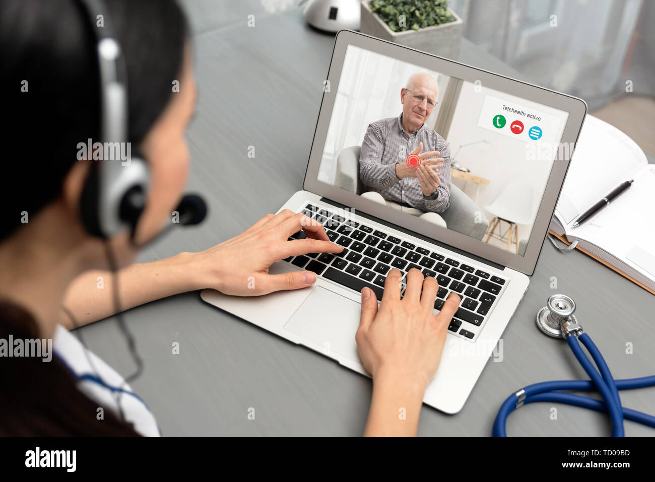 Doctor talking with a senior patient. Telemedicine concept Stock Photo ...
