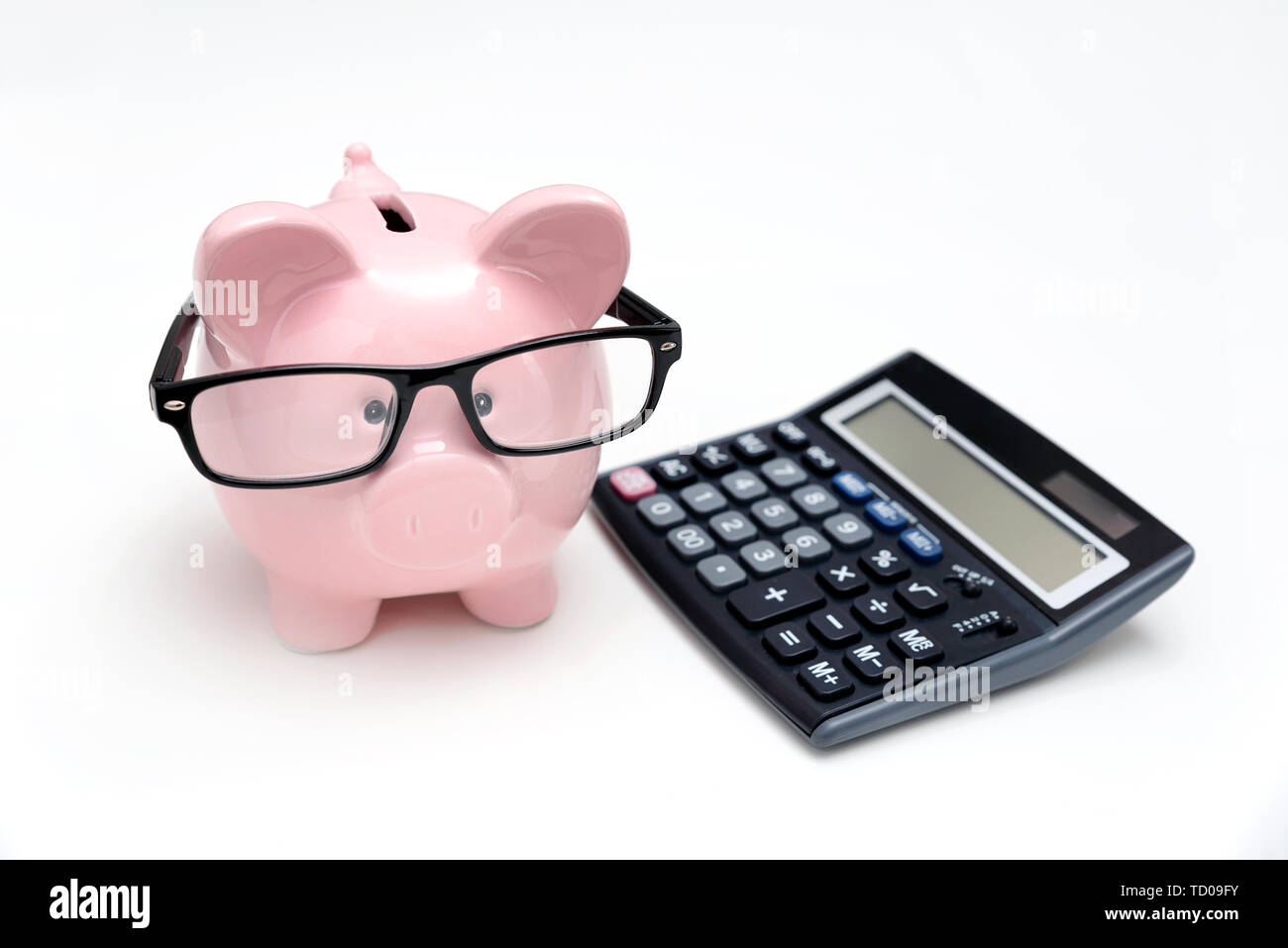 Piggy bank and calculator on white background. Savings and budget ...