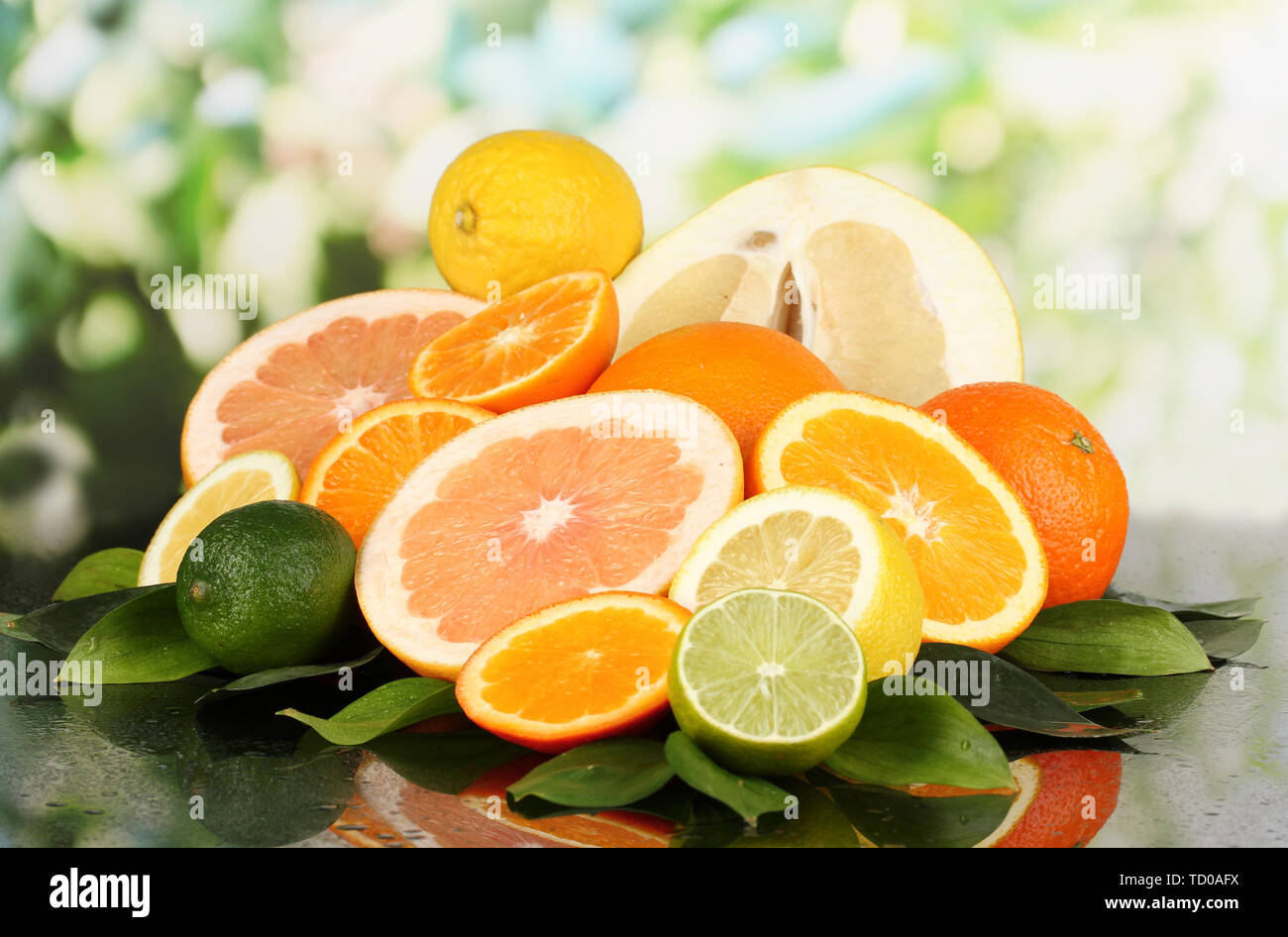 Lots ripe citrus on black table on natural background Stock Photo - Alamy