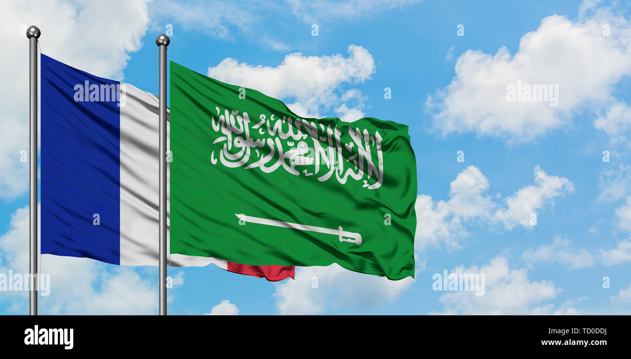 France and Saudi Arabia flag waving in the wind against white cloudy ...