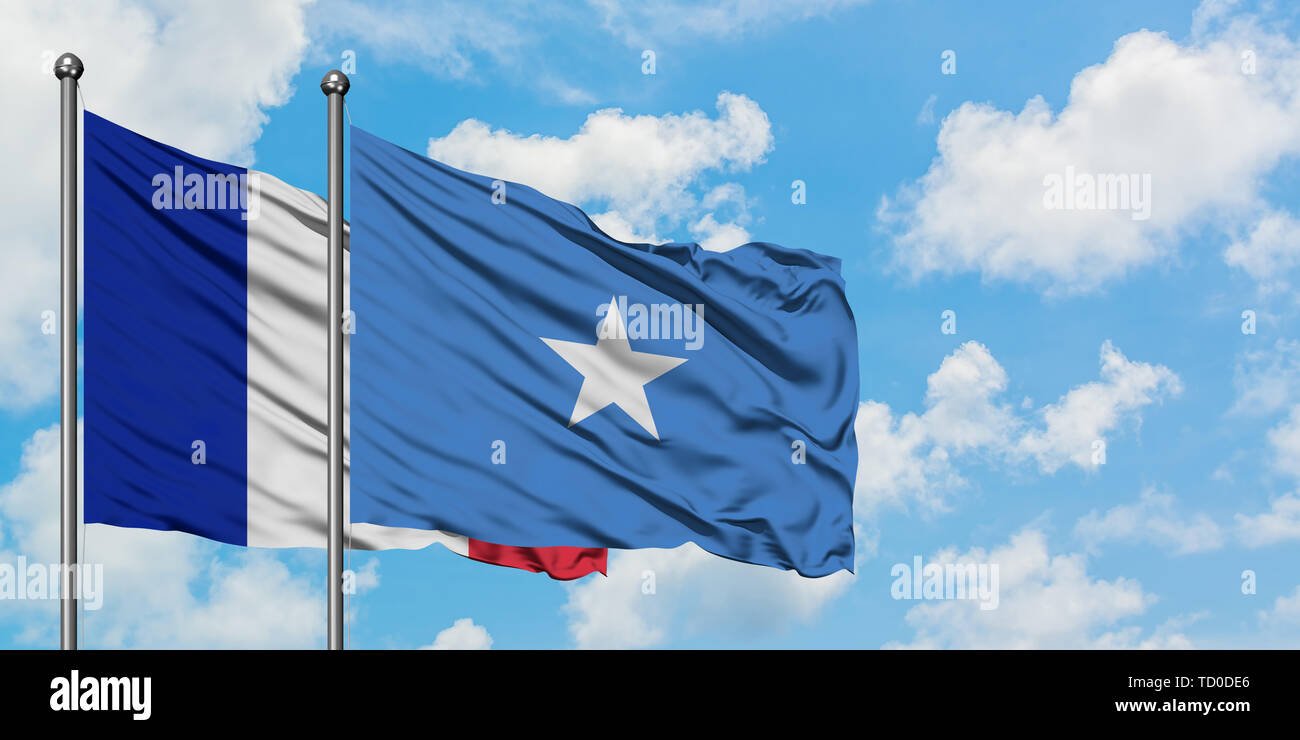 France and Somalia flag waving in the wind against white cloudy blue ...
