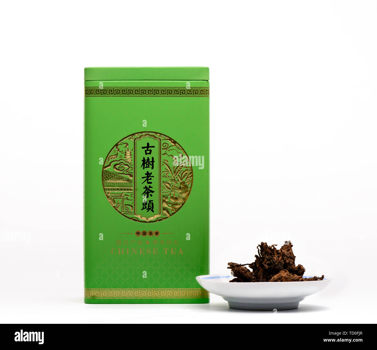 Old tea head ancient tree Pu'er tea iron box and tea display Stock ...
