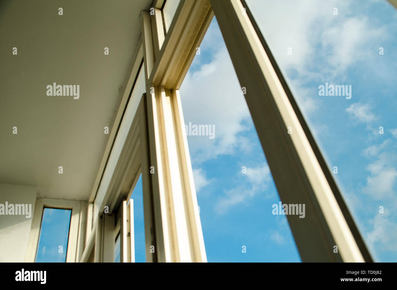 Through the balcony window to see the blue sky outside Stock Photo - Alamy