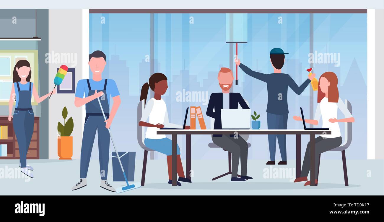 janitors team cleaners in uniform working together with professional ...