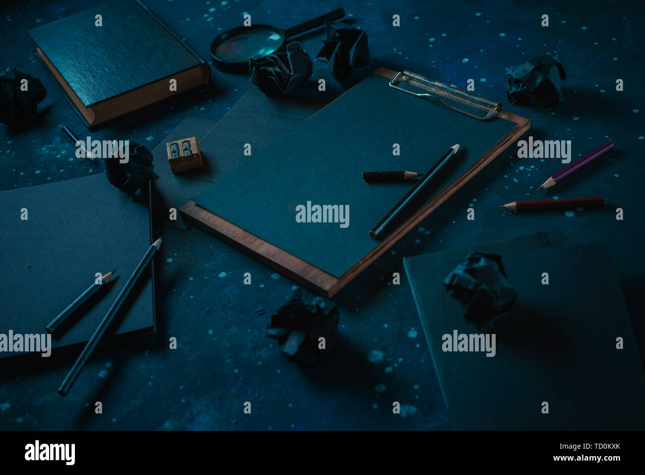 Science and research concept with a clipboard, black paper notes and a ...