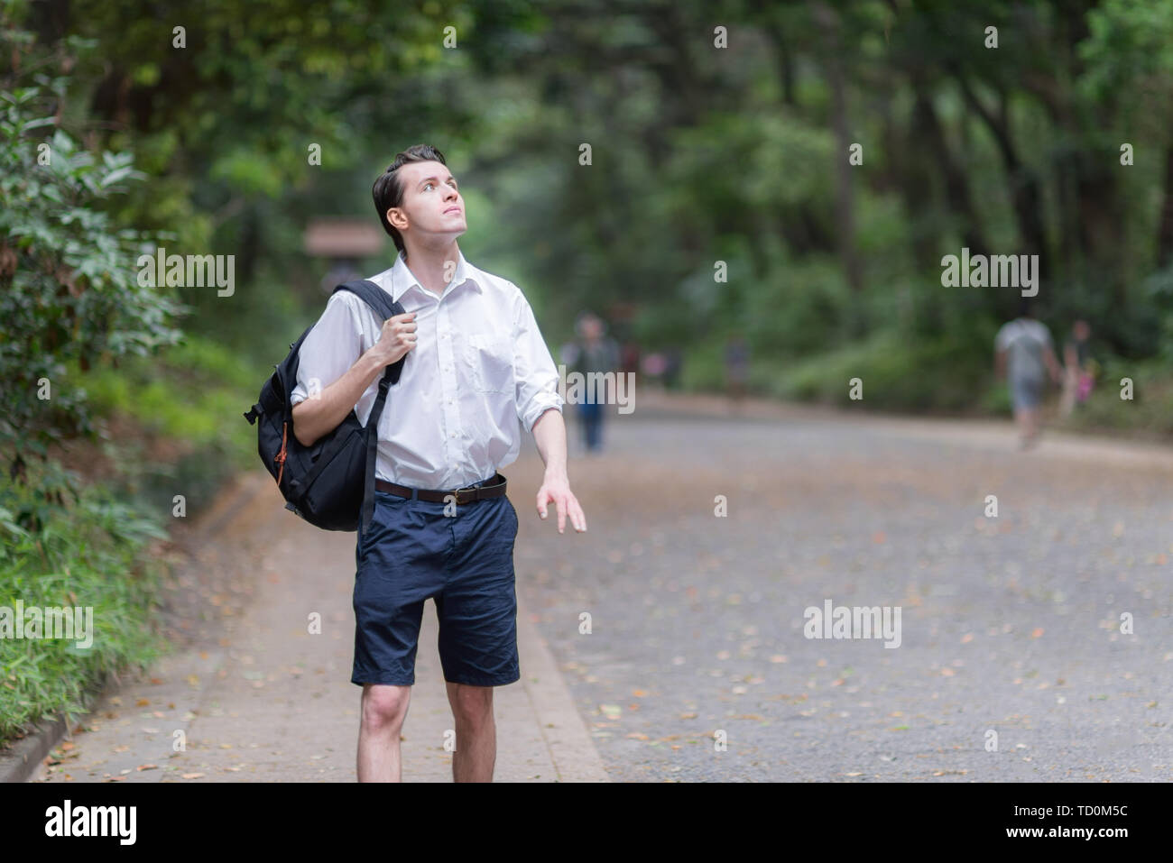 Young French man discover the green and nature area in Tokyo Stock ...