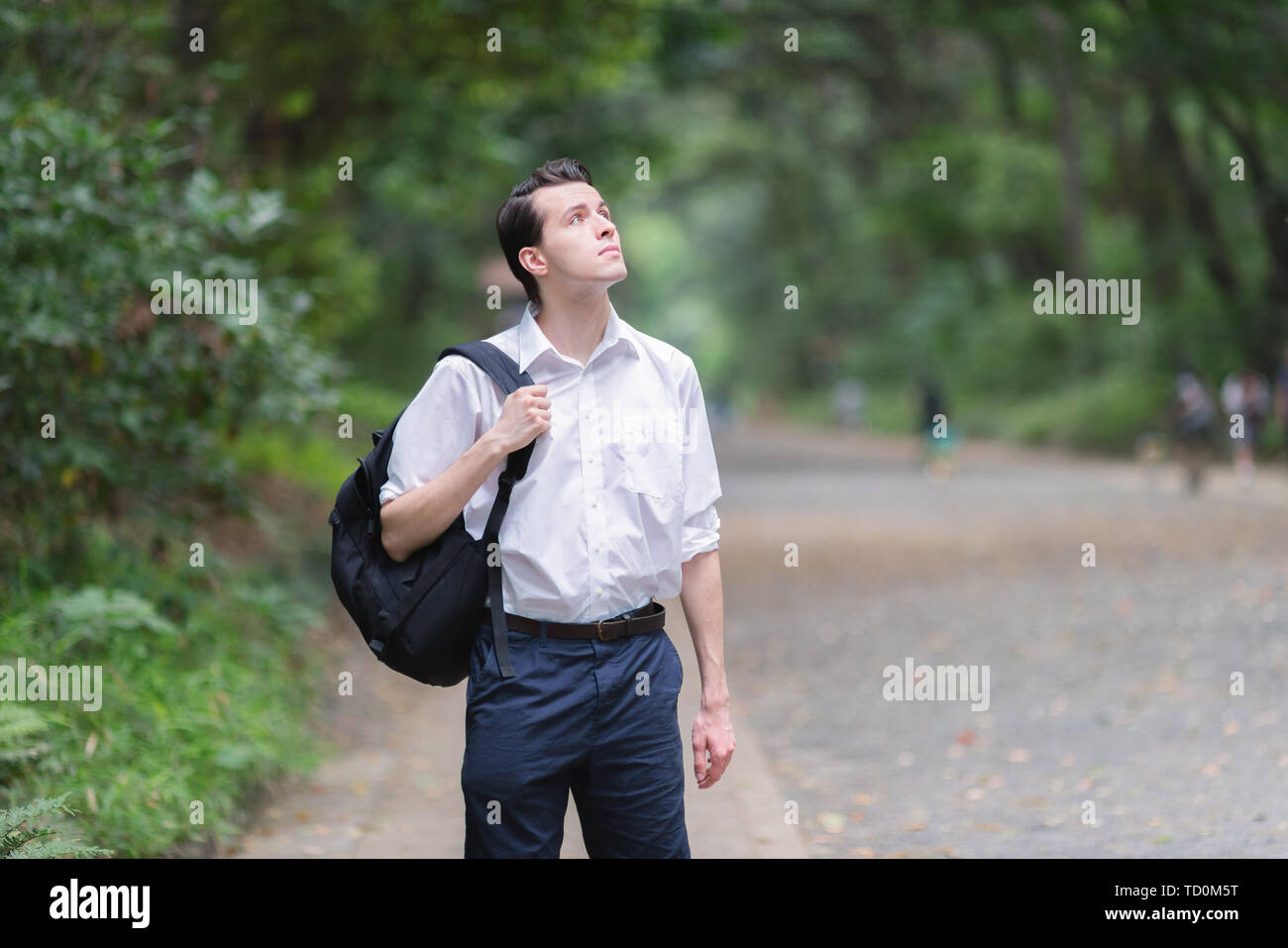 Young French man discover the green and nature area in Tokyo Stock ...