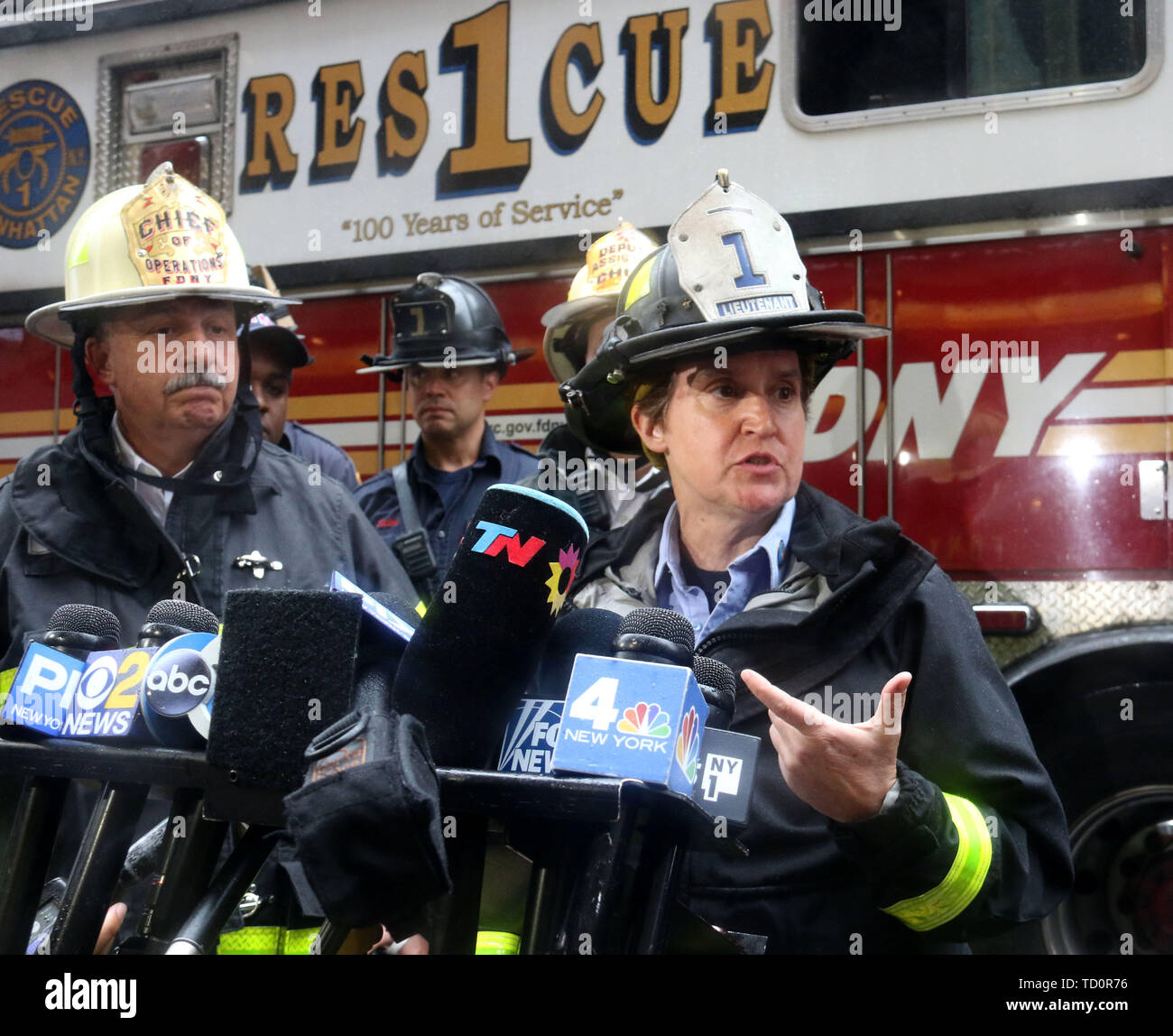 New York City, New York, USA. 10th June, 2019. (L) Fire department ...