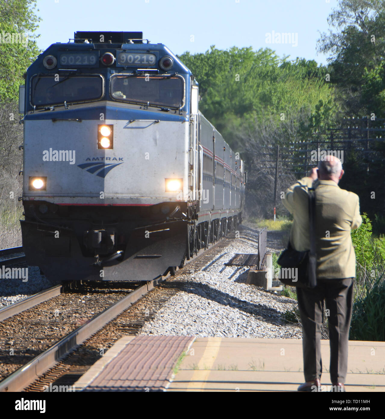 Sturtevant, Wisconsin, USA. 11th June, 2019. Chicago-bound commuters wait for, and board, Amtrak ...