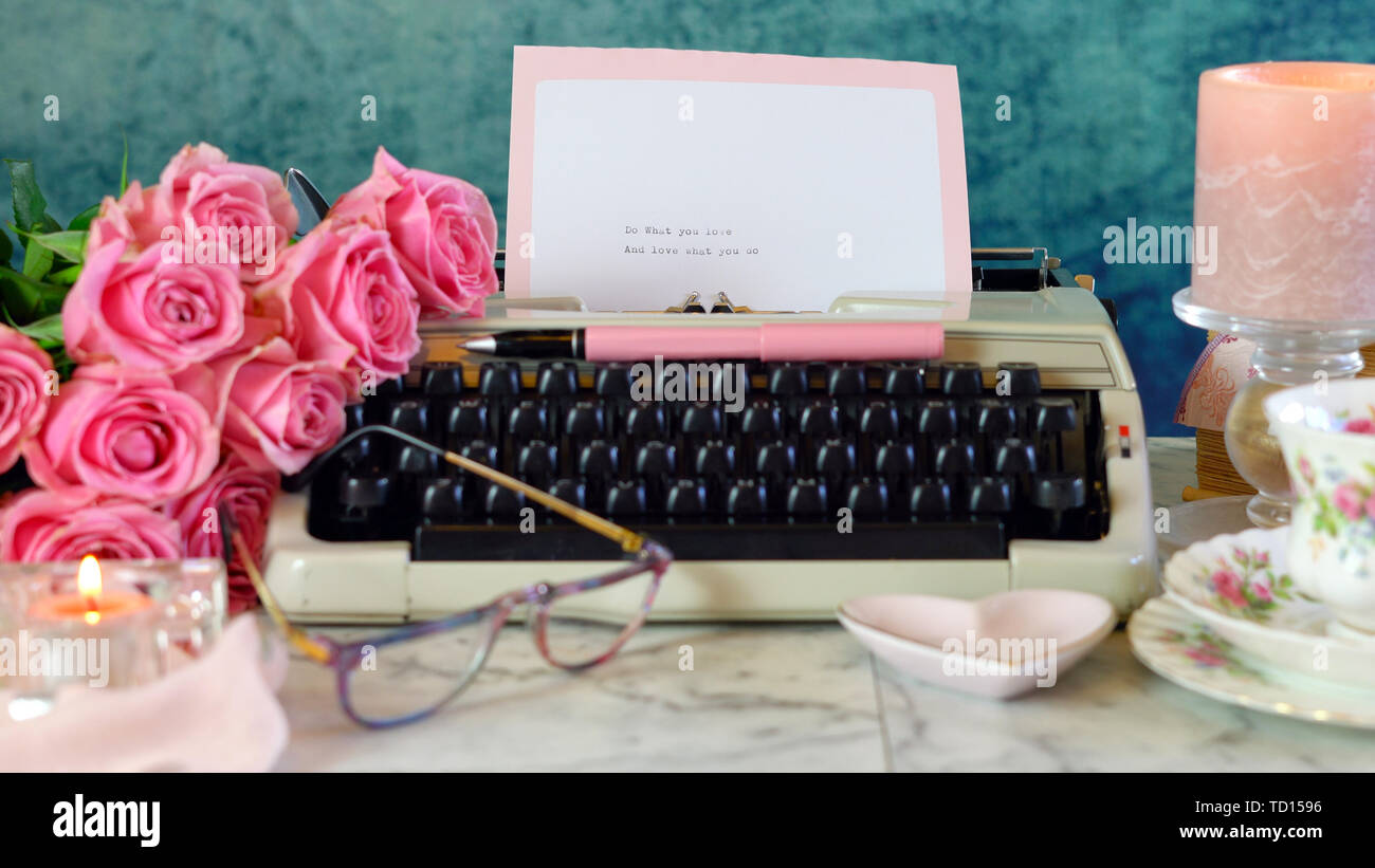 Romantic vintage feminine writing scene, tea break with old typewriter ...