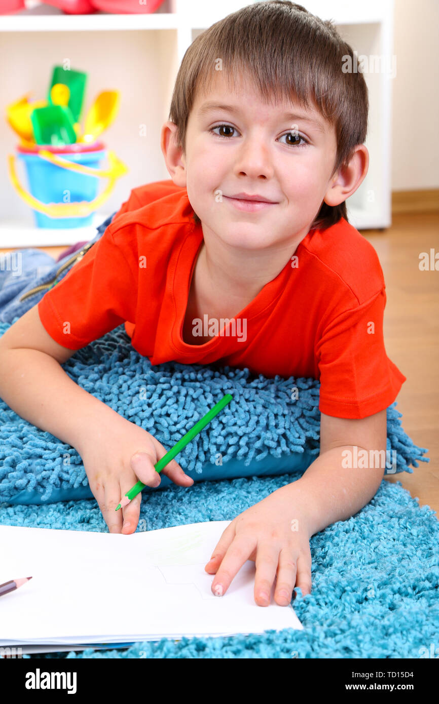 Small boy drawing colorful crayons hi-res stock photography and images ...