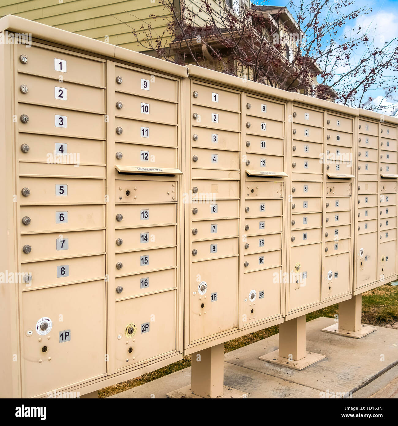 Square Residential mailboxes with numbered compartments on the side of ...