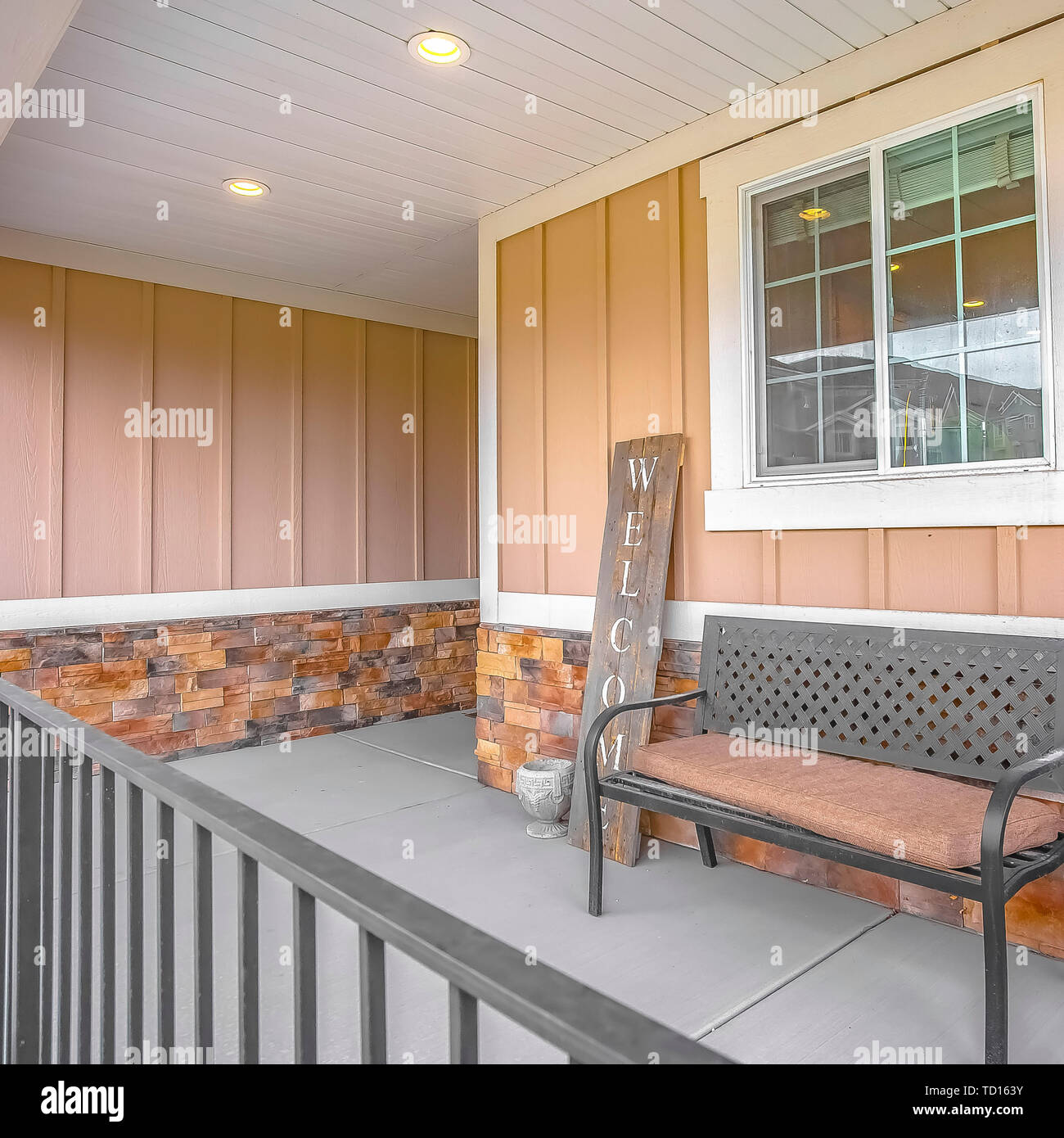 Square frame Bench and stool in front of a window at the porch of a ...
